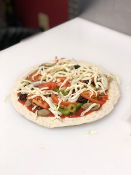 Turn 4 Pizza - Medium Race winning pizza double cheese double pepp