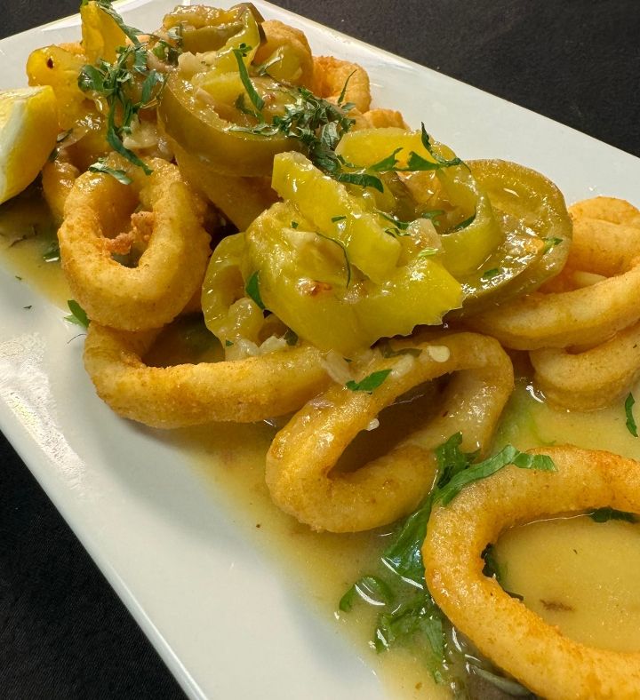 Andrew's Bistro - Italian Creme Cake with coconut & Chocolate chips